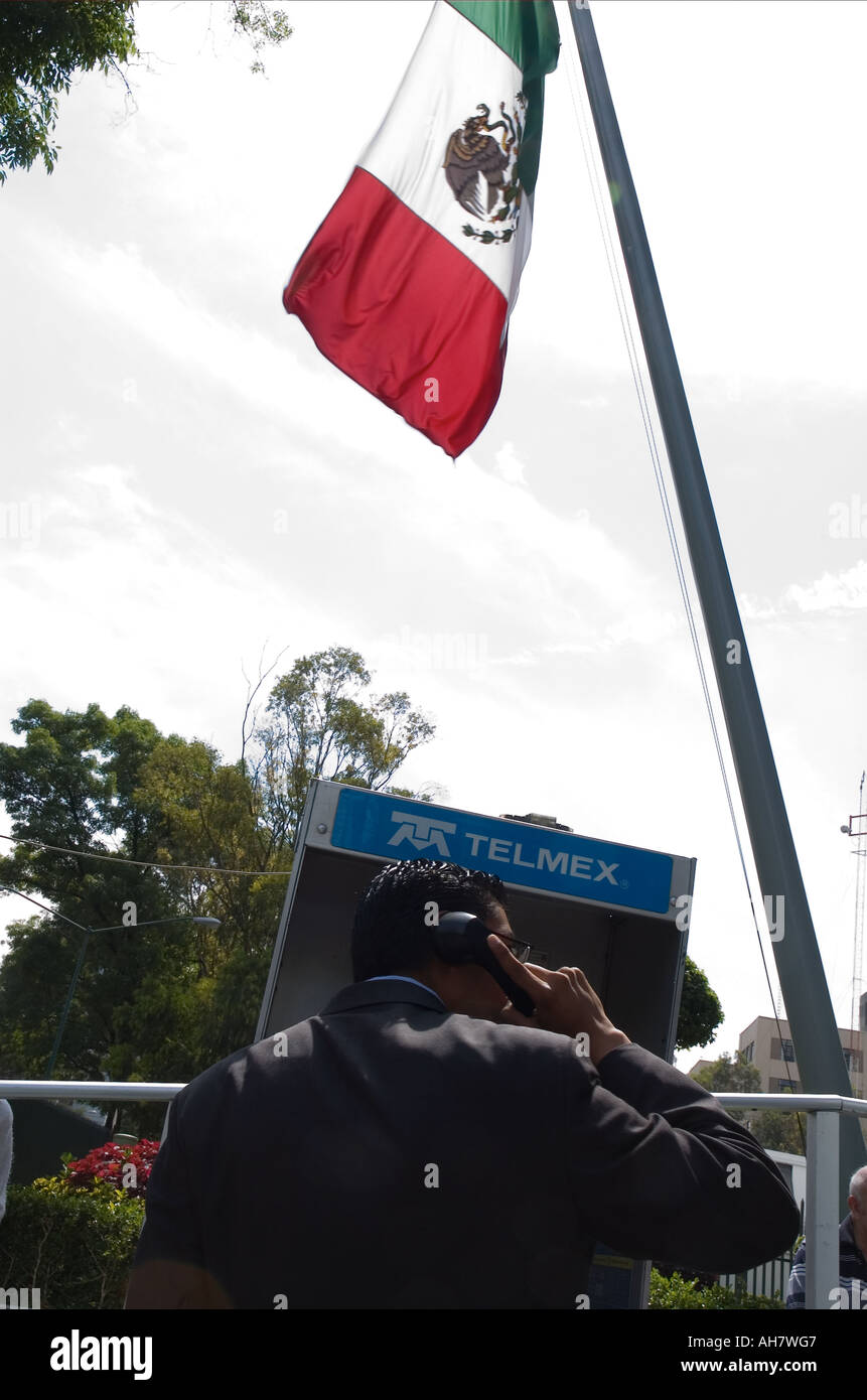 Customers use public phones in front of the Telmex headquarters in ...