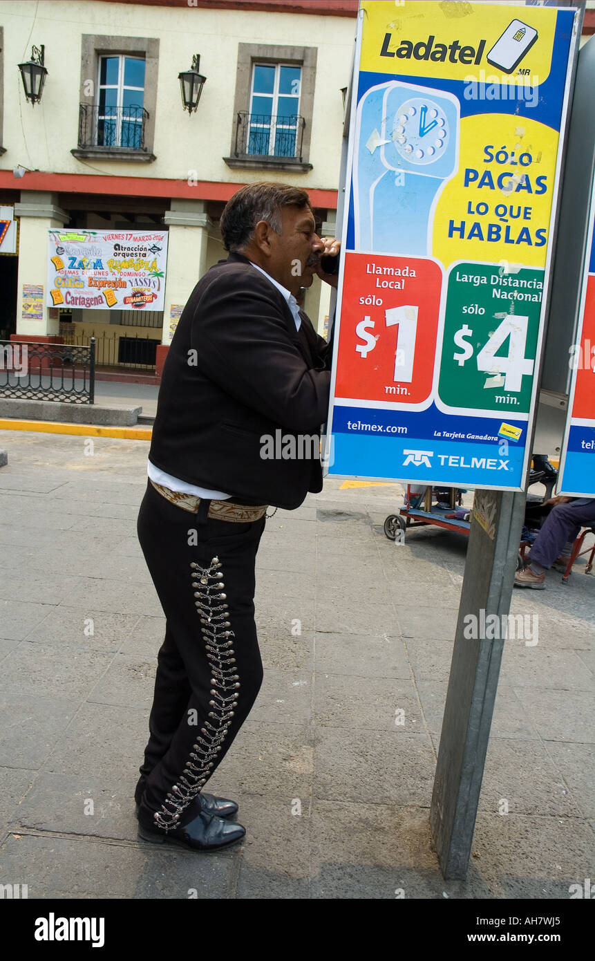 A mariachi musician calls from a public phone Stock Photo - Alamy