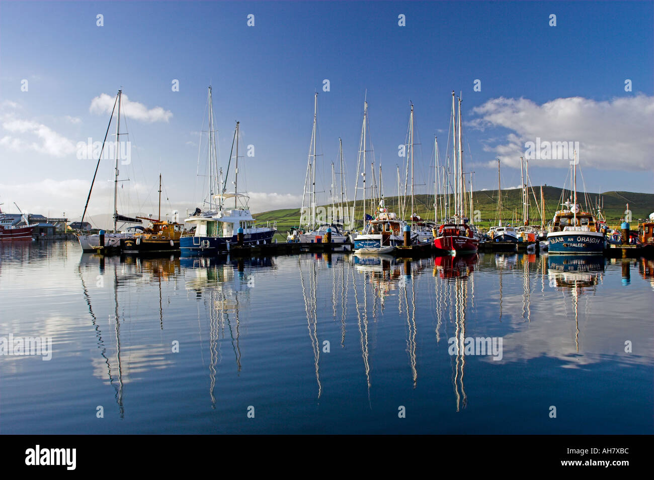 Ireland County Kerry Dingle Peninsula Boats reflected in the still ...