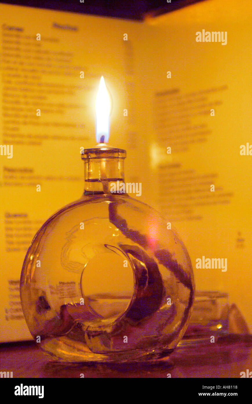 Glowing candle and menu in restaurant Stock Photo - Alamy