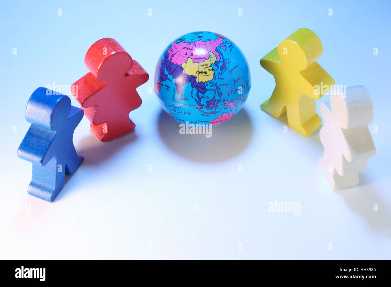 Wooden Children Figures and Globe Stock Photo - Alamy