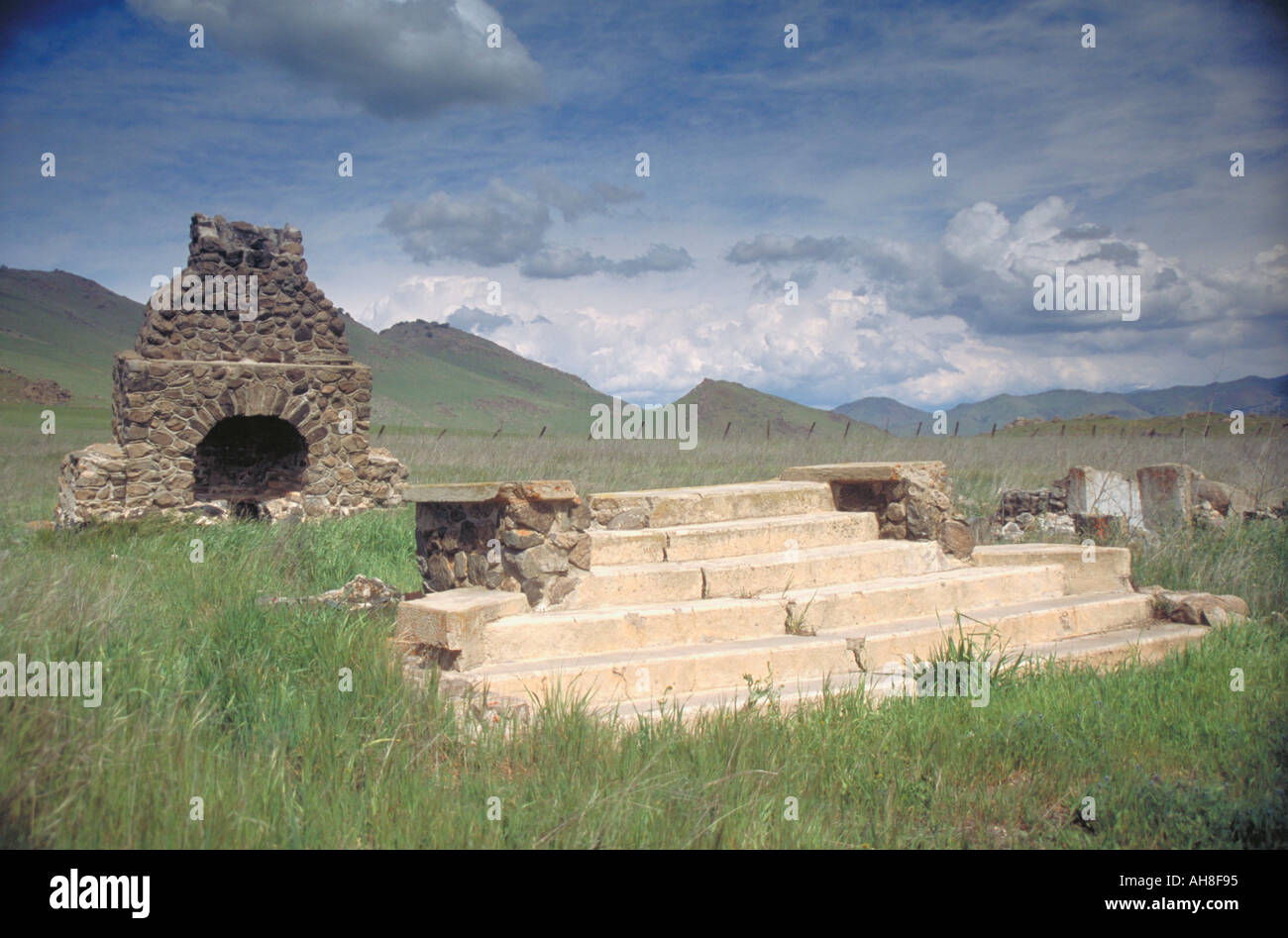 Barren stairs and an empty fireplace give testimony to a home that ...