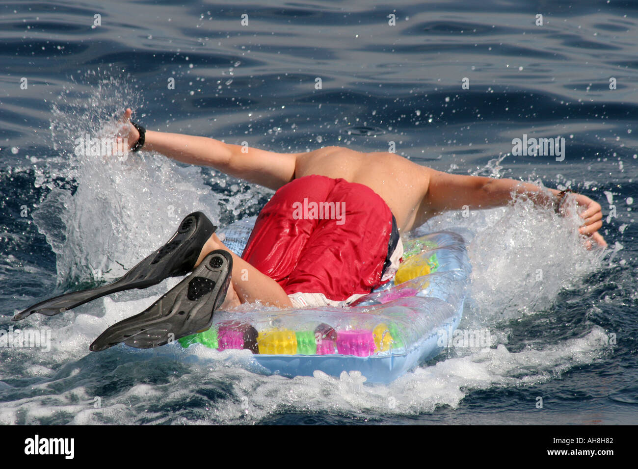 Boy on lilo hi-res stock photography and images - Alamy