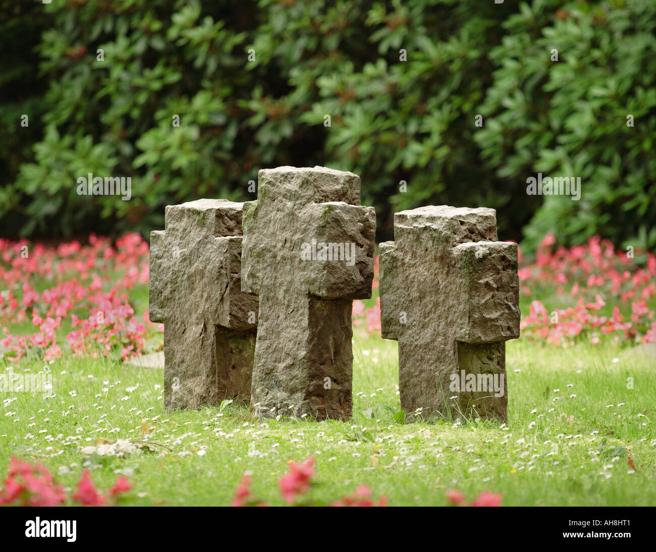 Three cross shaped gravestones without inscription Stock Photo - Alamy