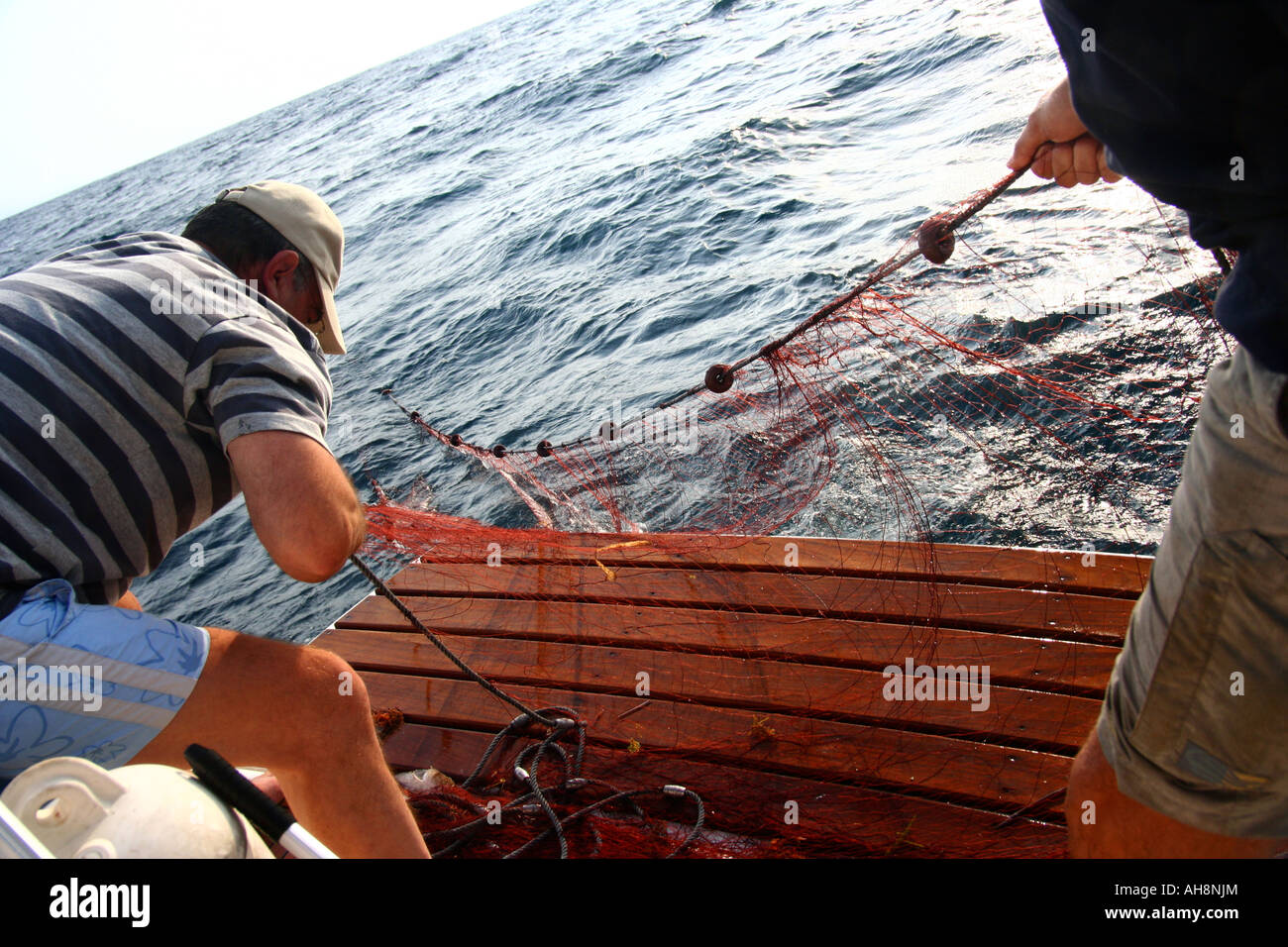 Fishermen pulling a net out of the sea Stock Photo - Alamy