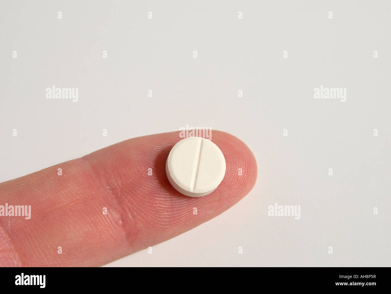 small tablet on the finger tip Stock Photo - Alamy