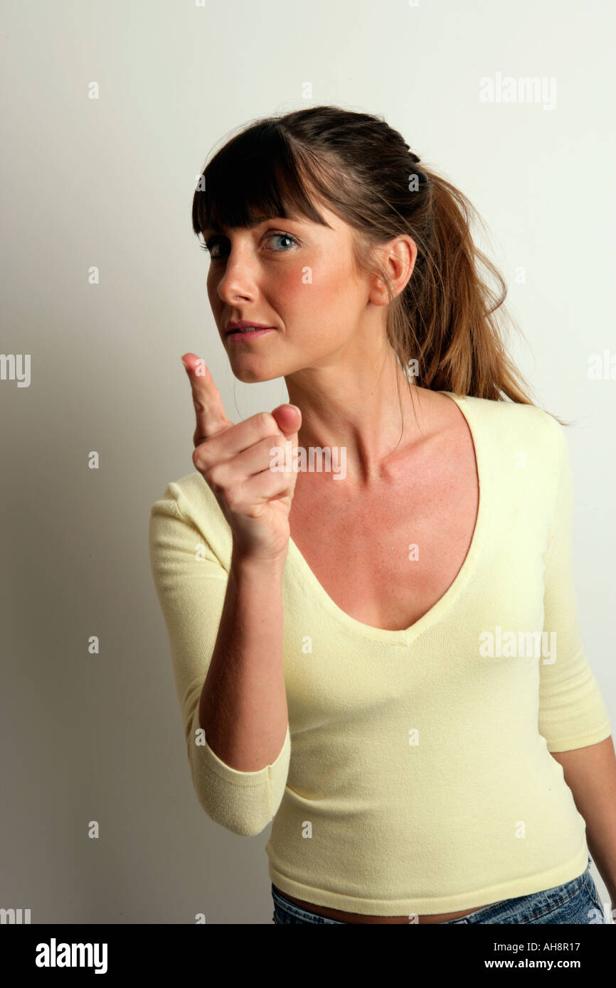 Woman finger pointing nose hi-res stock photography and images - Alamy