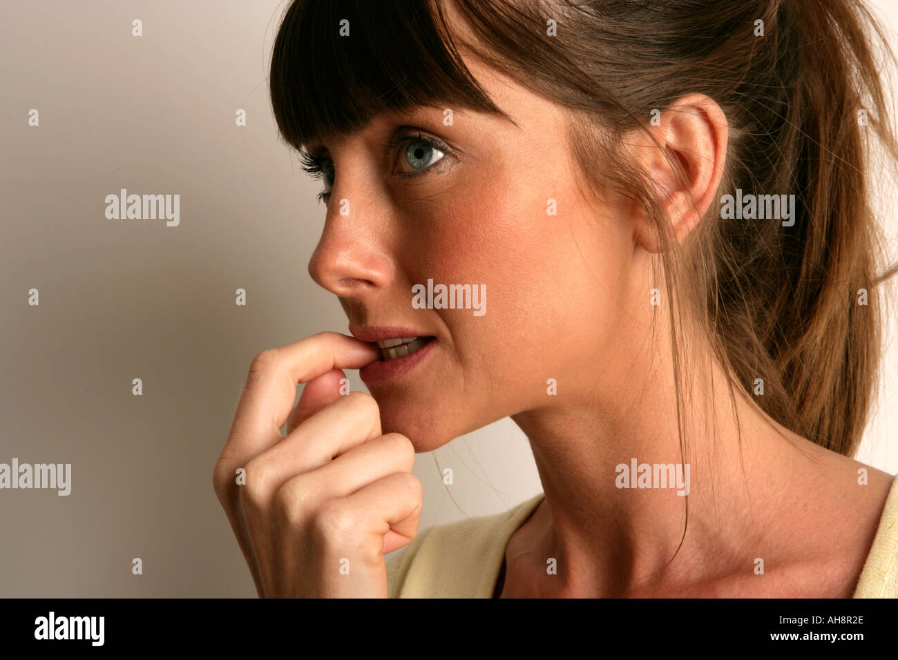 Woman biting her nails Expressions Worried stressed thoughtful nervous ...