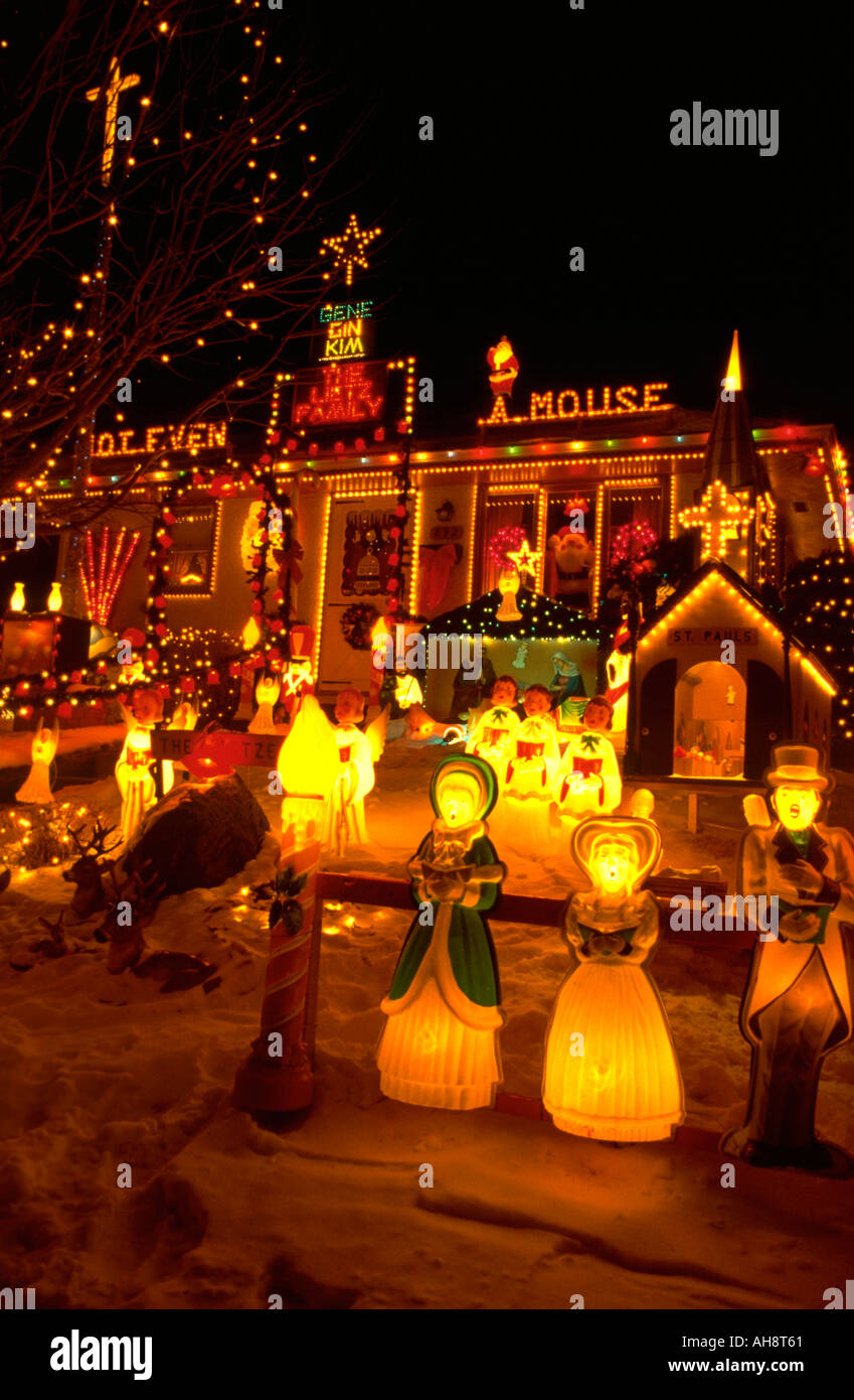 Outdoor lighted Christmas scene in snowy yard of house. St Paul ...