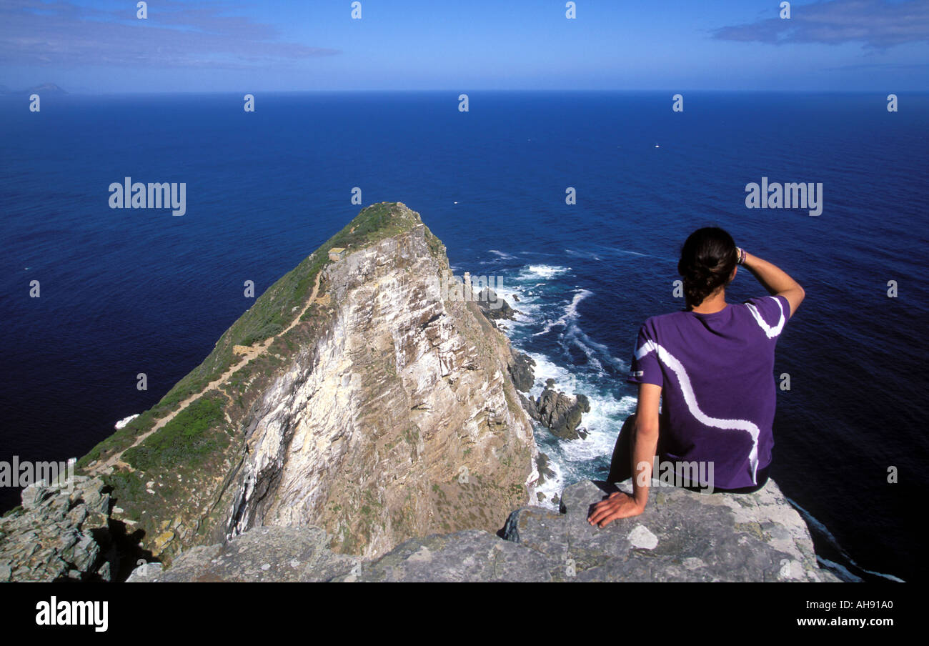South Africa Cape Town Young man watching the Cape Point where the ...