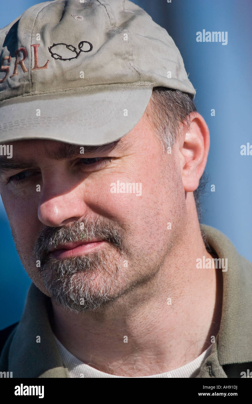 Cap man glancing across hi-res stock photography and images - Alamy