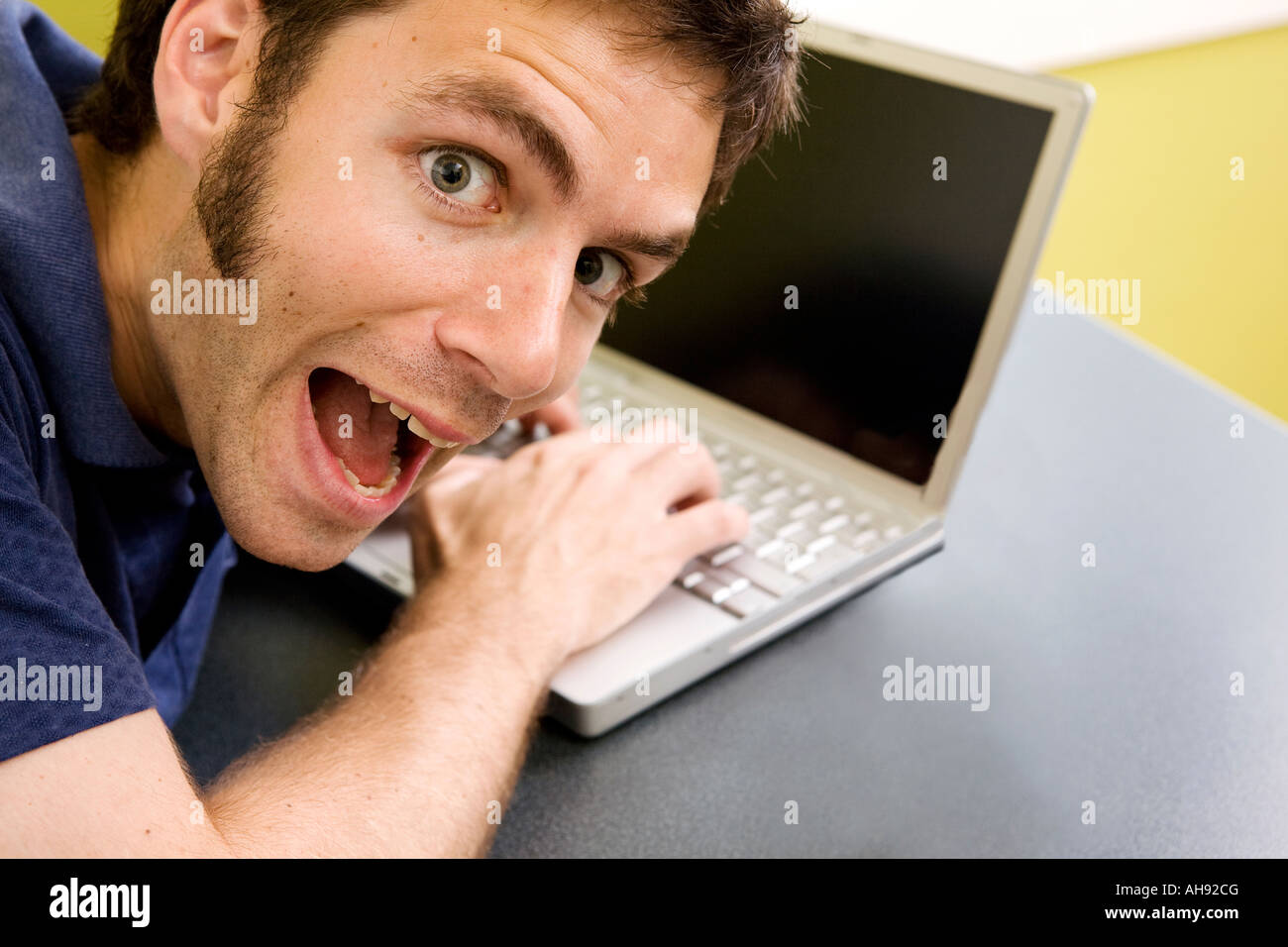 A wild man at the computer Stock Photo - Alamy