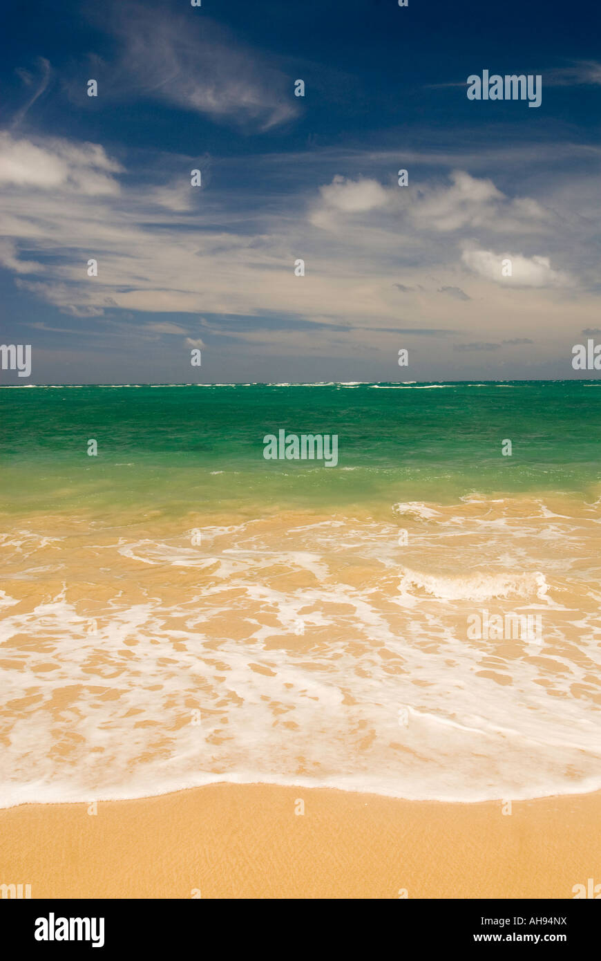 Hawaii Oahu Aqua blue and emerald green ocean waves roll onto a sandy ...