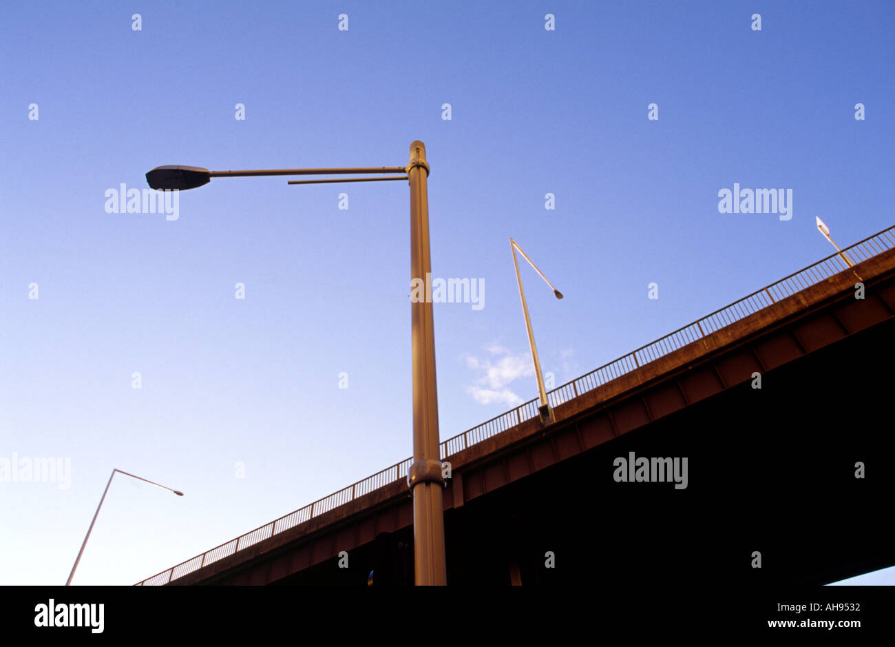 Overhear highway overpass with number of slim city street lights along ...