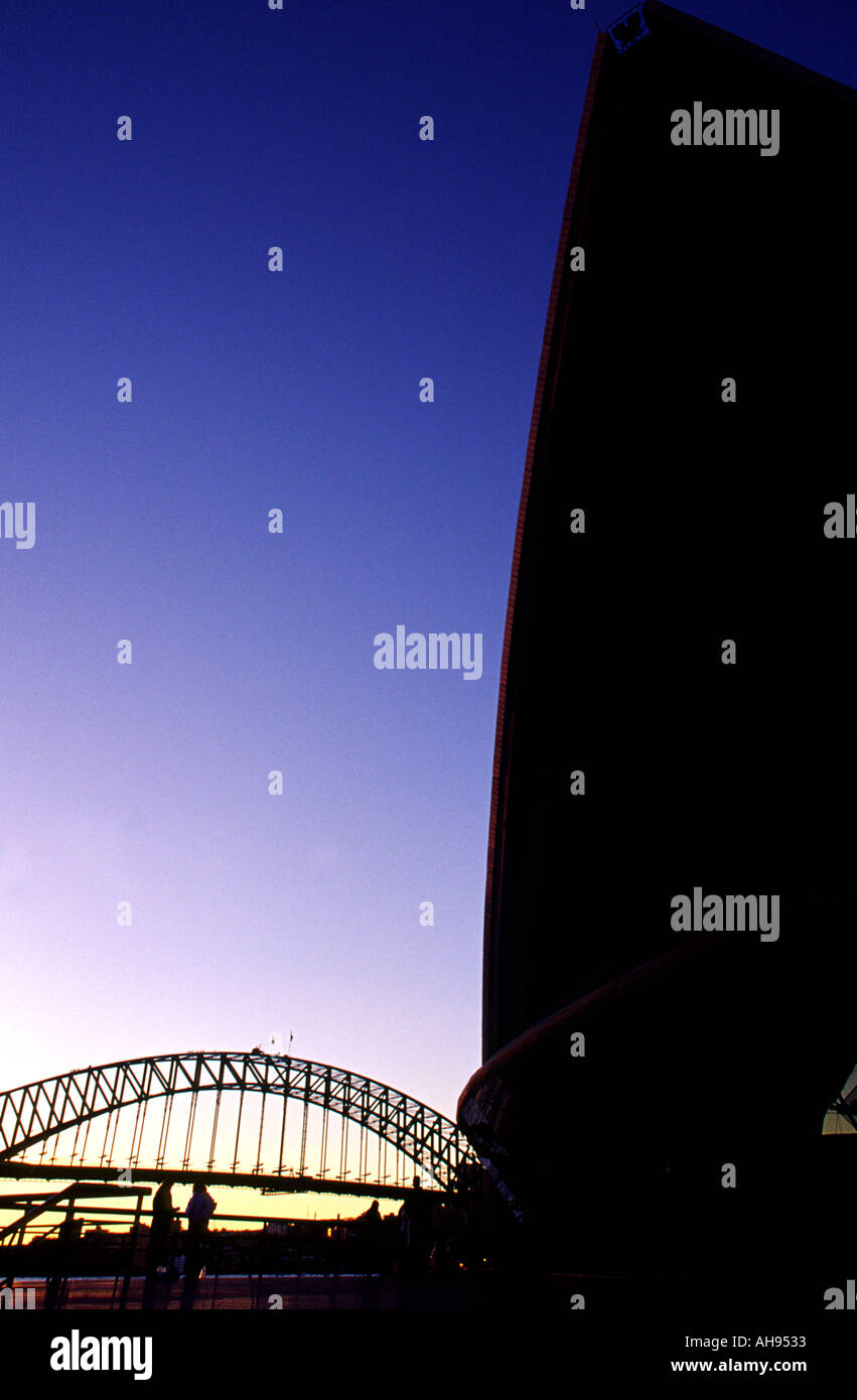 Silhouette of the Opera house shell with the Sydney Harbour Bridge in ...