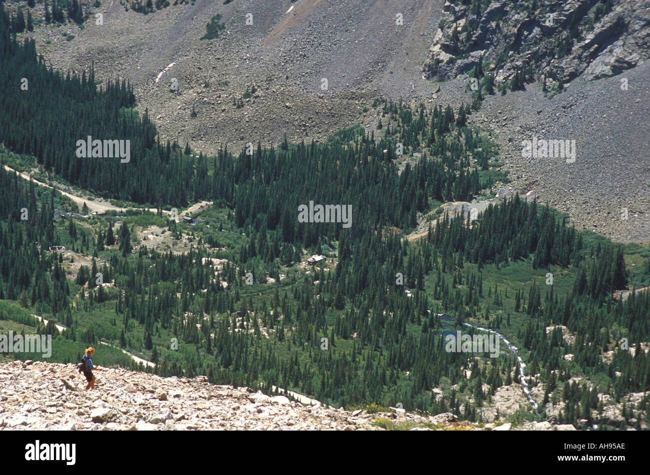 Lone hiker trekker on Colorado Rocky Mountain scree slope Stock Photo ...