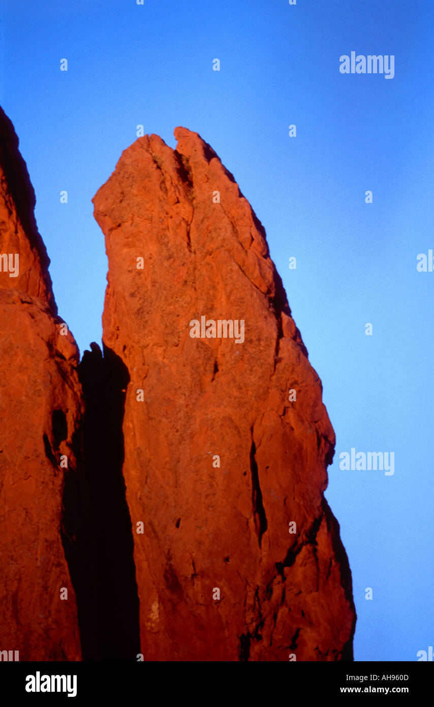 Extreme rock climber sitting cleft of the rock in shadow Look closely ...