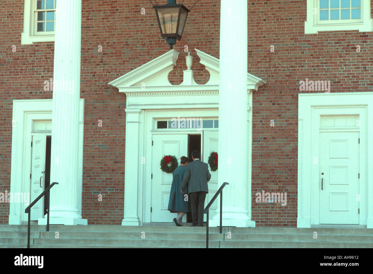 Woman entering colonial church to worship on Sunday Stock Photo - Alamy