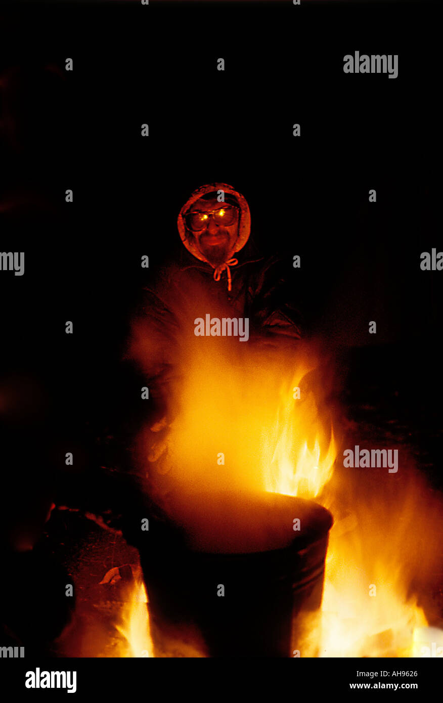 Man looking evil in front of campfire Stock Photo - Alamy