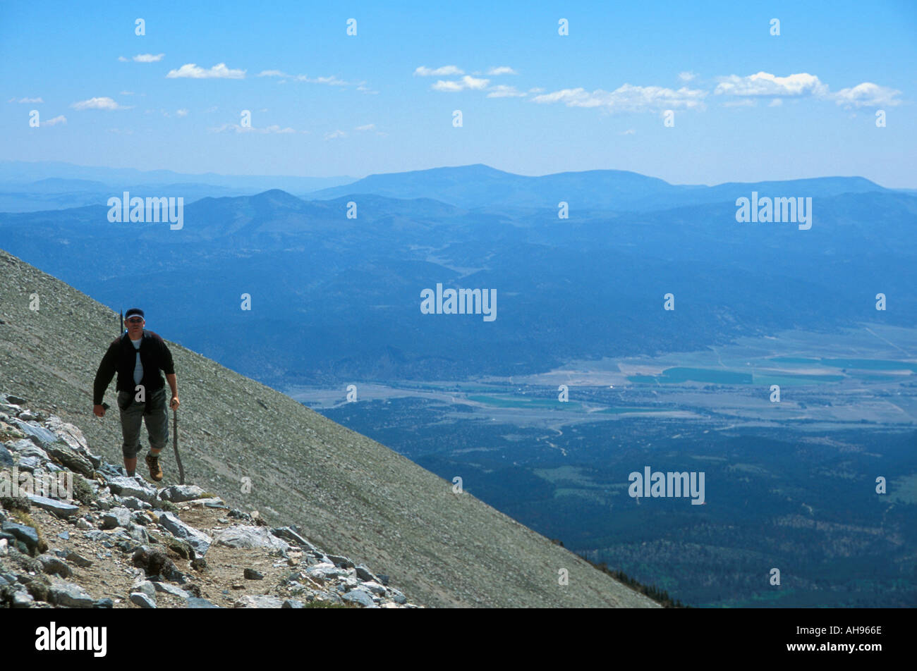 Hiker on steep slope in Colorado Rocky Mountains Stock Photo - Alamy