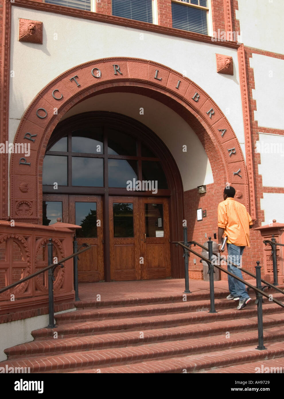 Student walking into Proctor Library at Flagler College, St. Augustine ...