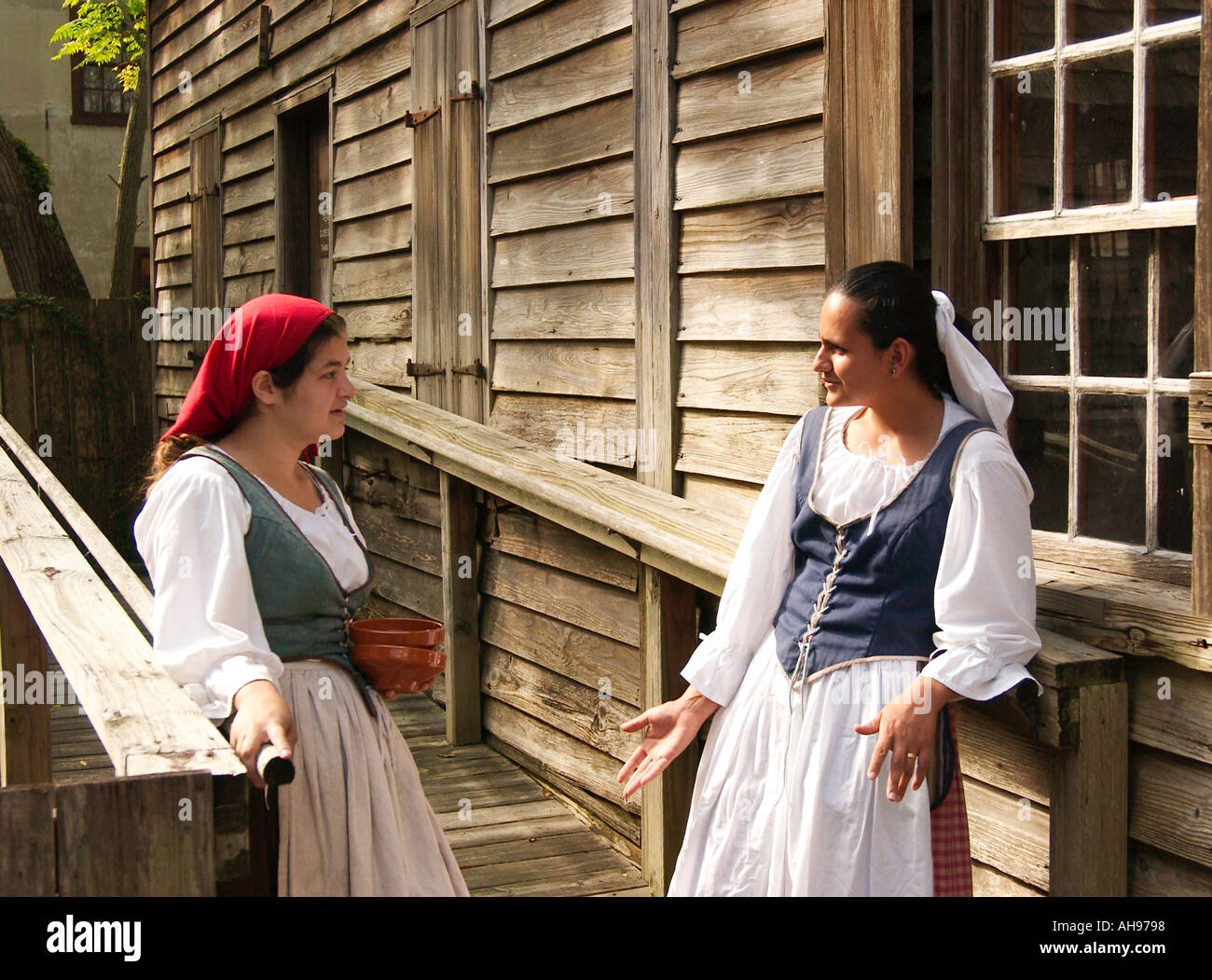 Two Spanish women in colonial-era clothing reenact history in St ...