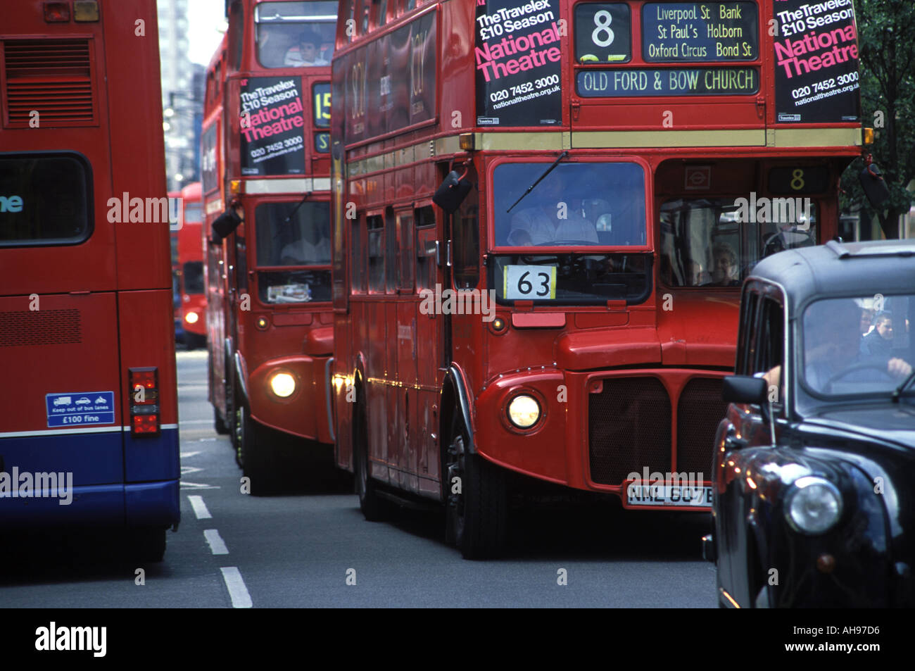 Red double decker buses on Oxford Street in central London Stock Photo ...