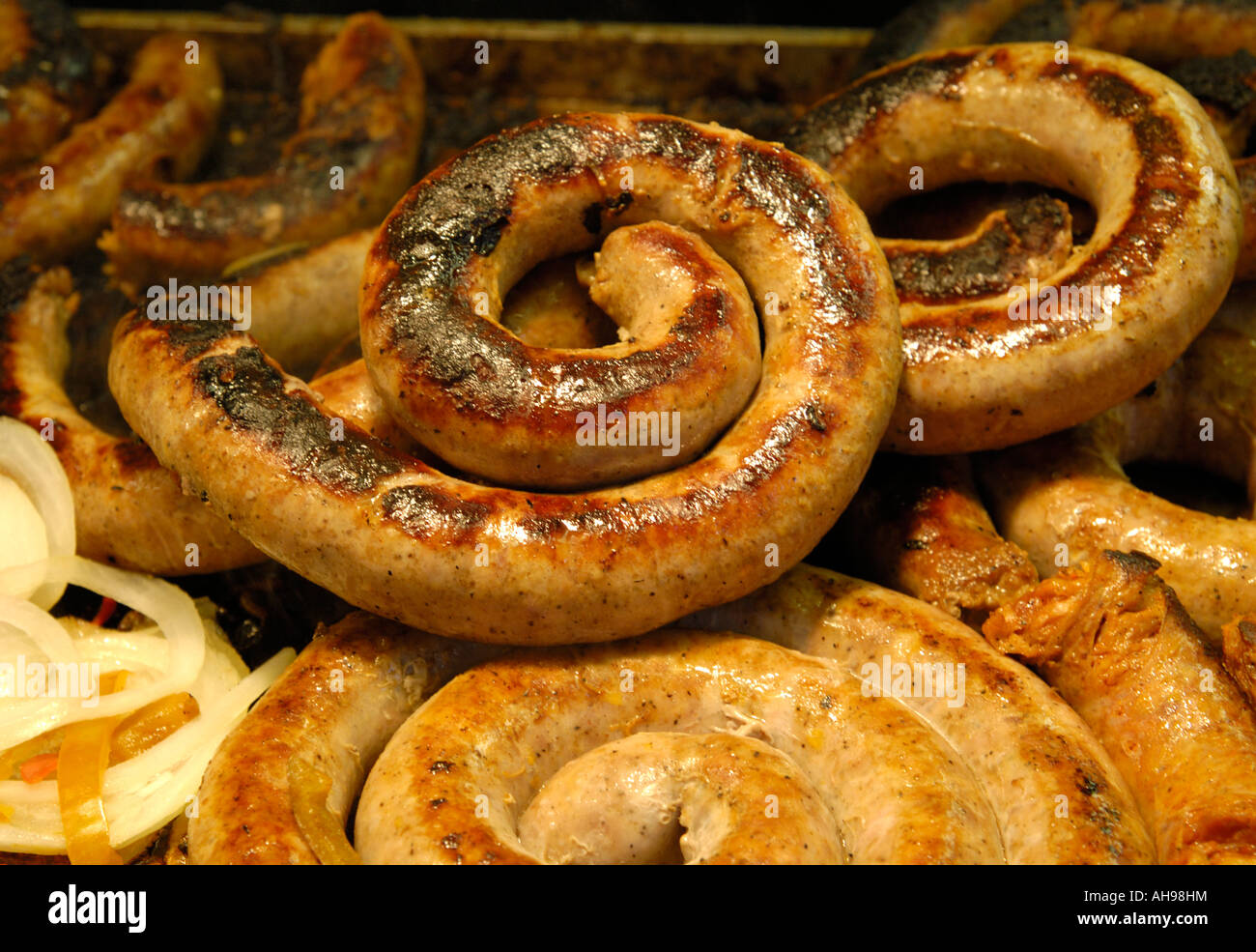 Italian sausages cooking Stock Photo - Alamy