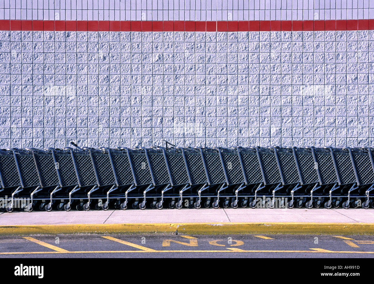 graphic shopping carts against a white cement block wall Stock Photo ...