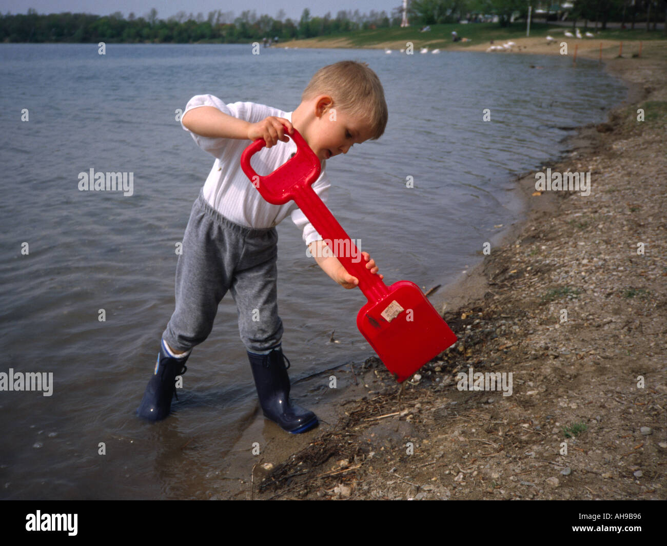 Boy is scooping Stock Photo - Alamy