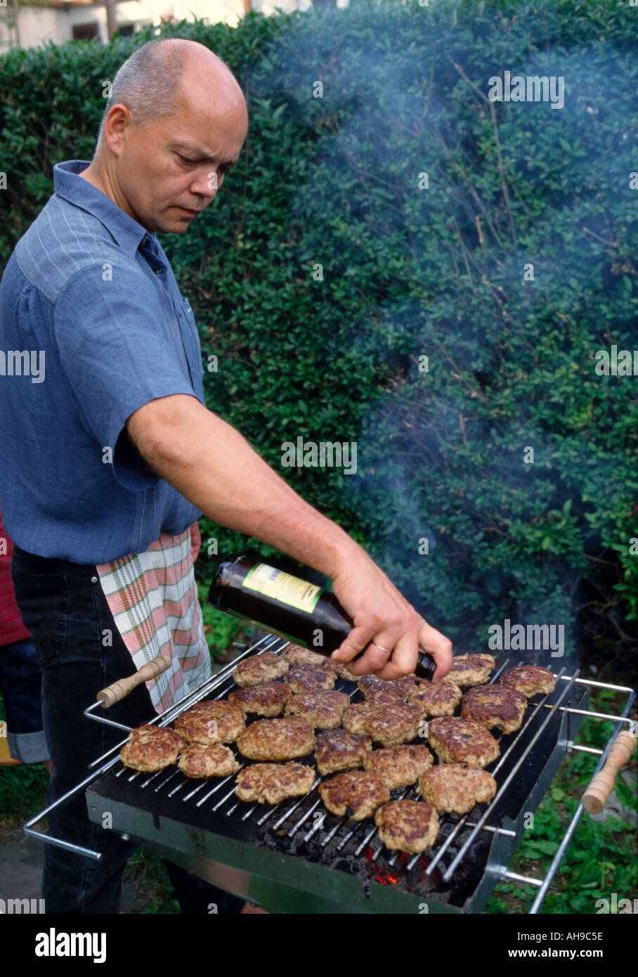 Having a barbecue Stock Photo - Alamy