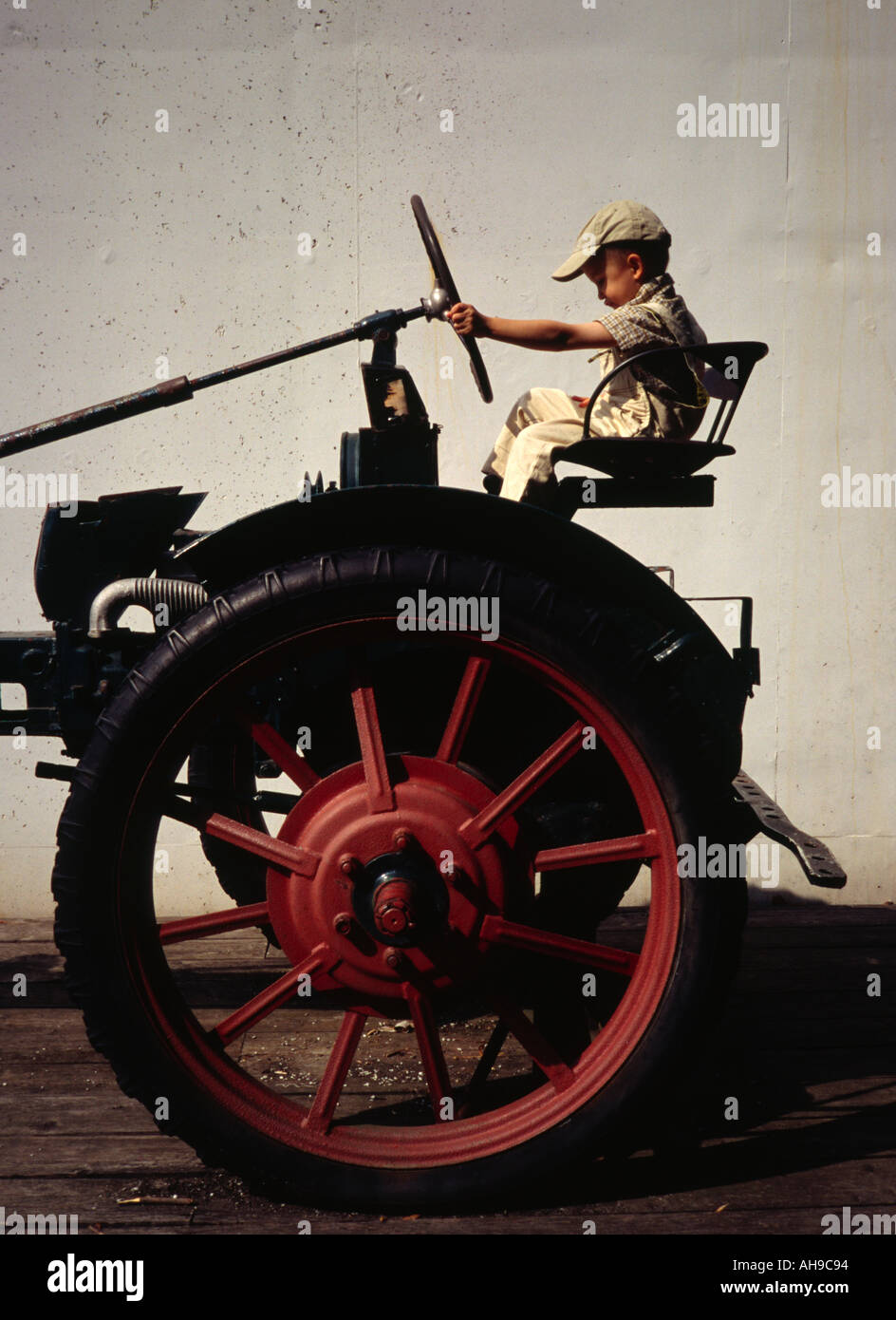 Farm boy driving tractor hi-res stock photography and images - Alamy