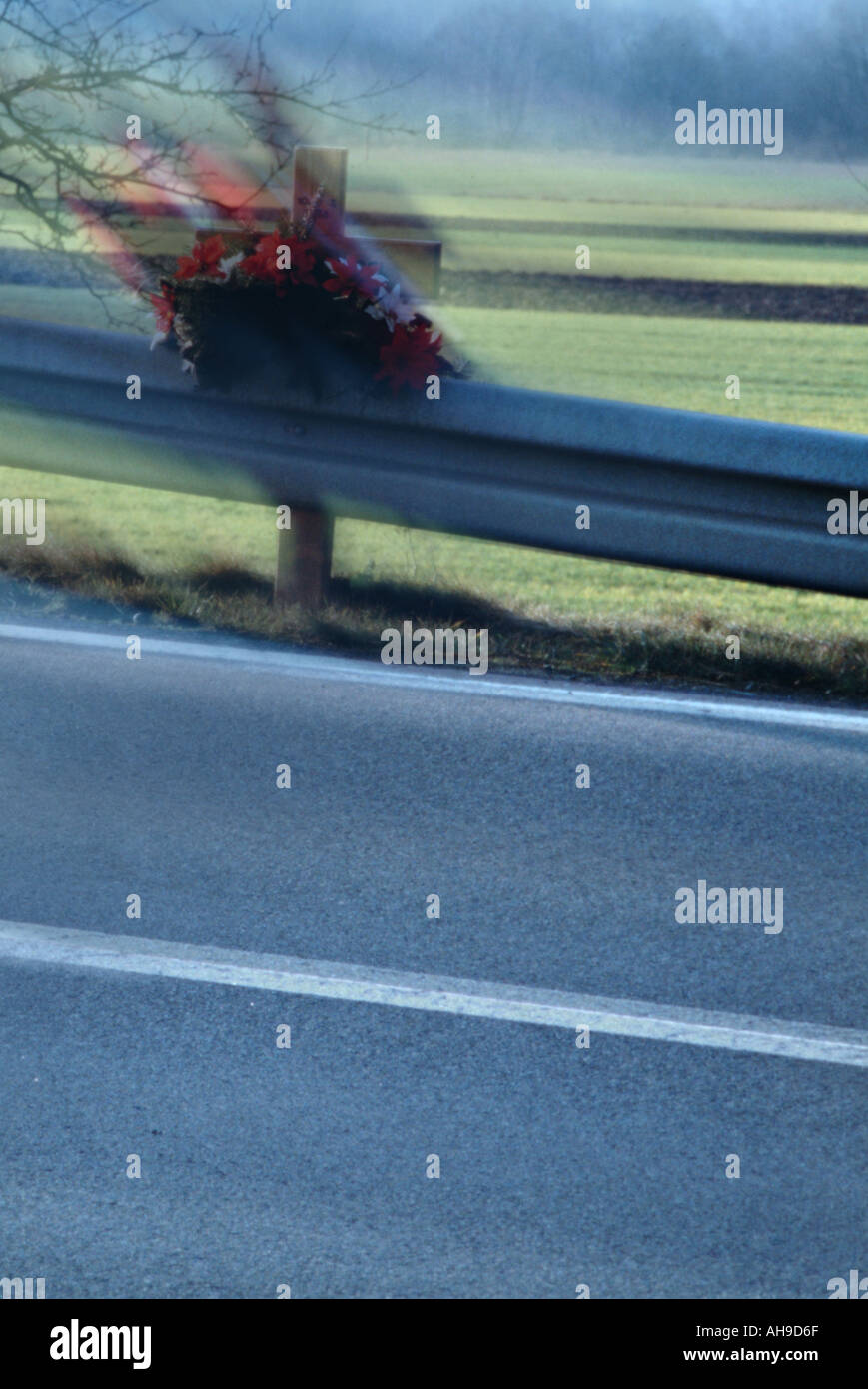 cross for the victims of traffic on a crash barrier Stock Photo - Alamy
