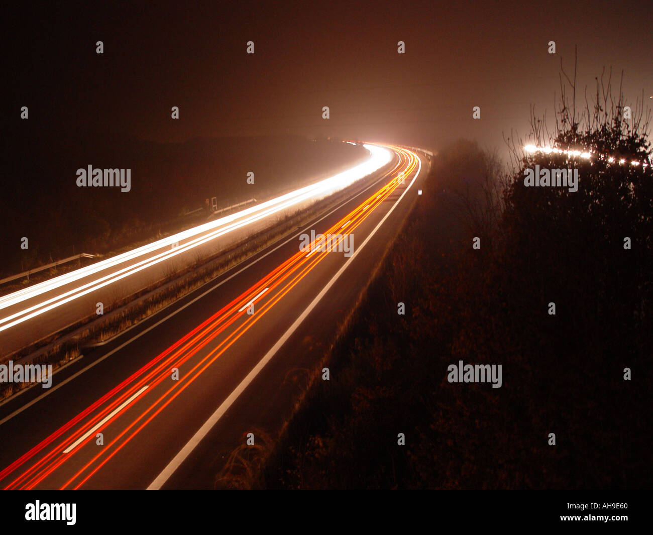 Motorway with light track Stock Photo - Alamy