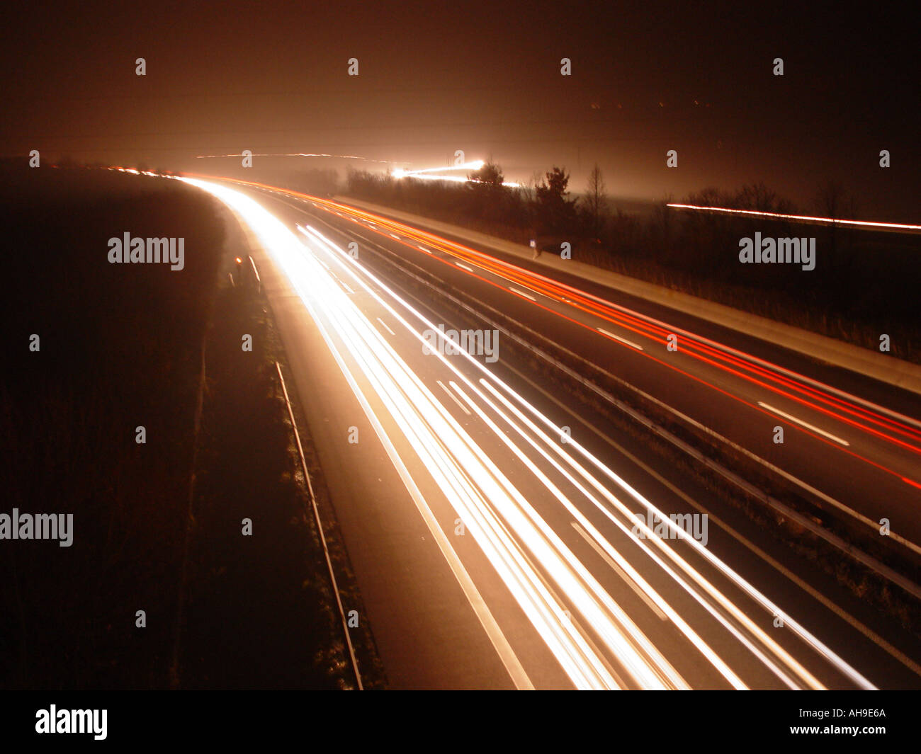 Motorway with light track Stock Photo - Alamy