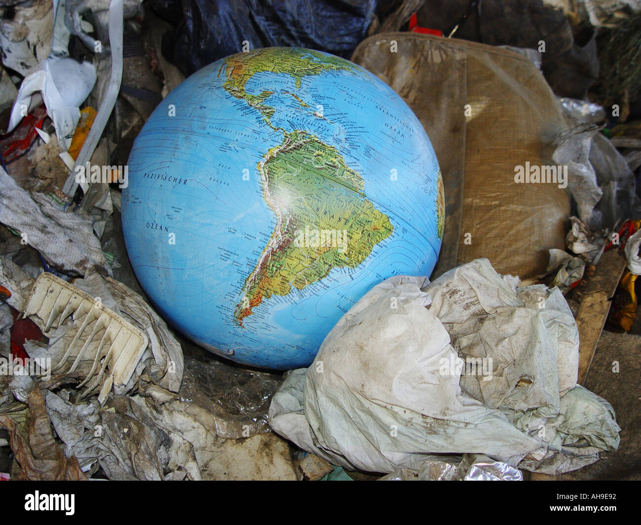 Symbol picture The world sinks in the garbage Stock Photo - Alamy