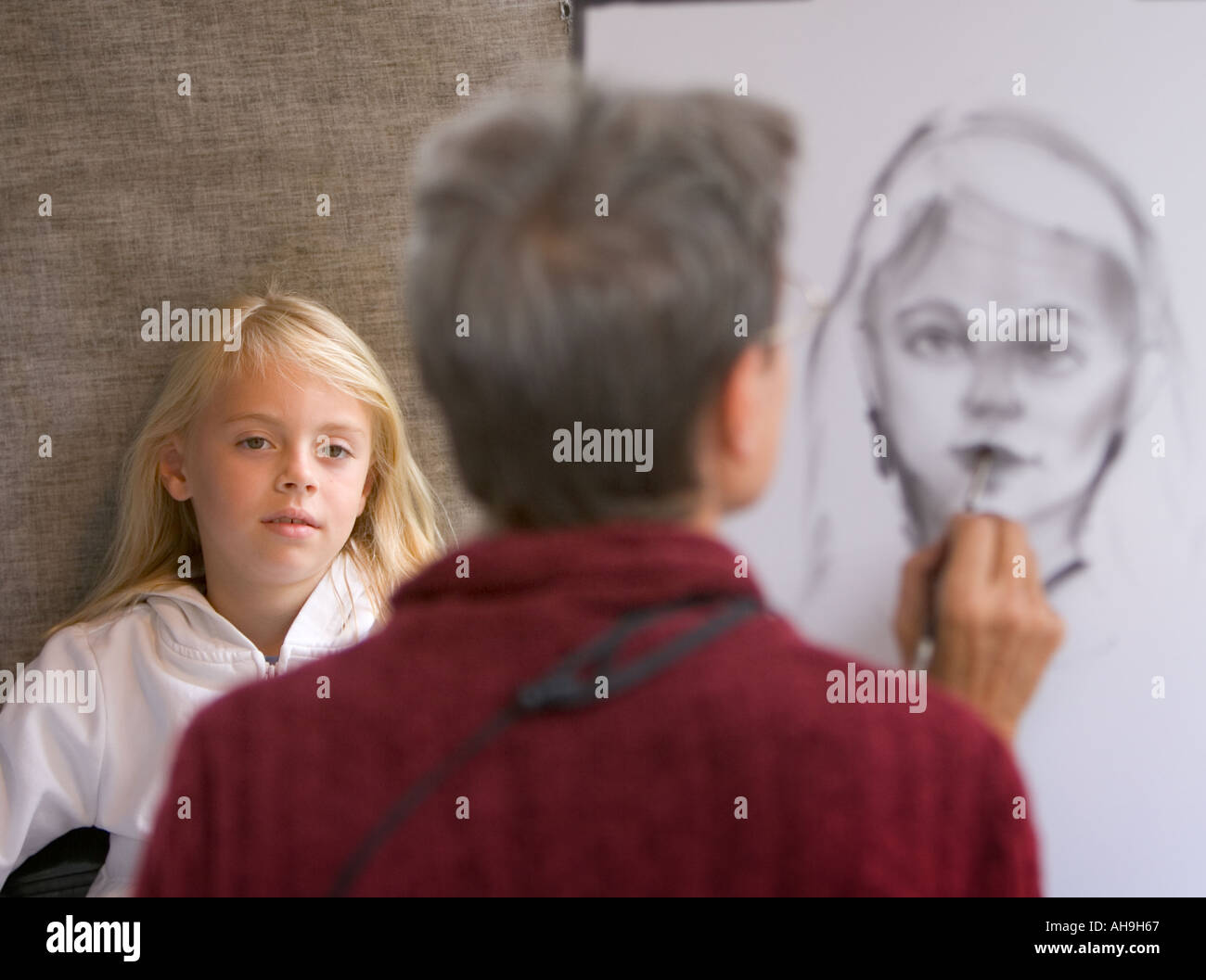 Artist sketching a child Stock Photo - Alamy