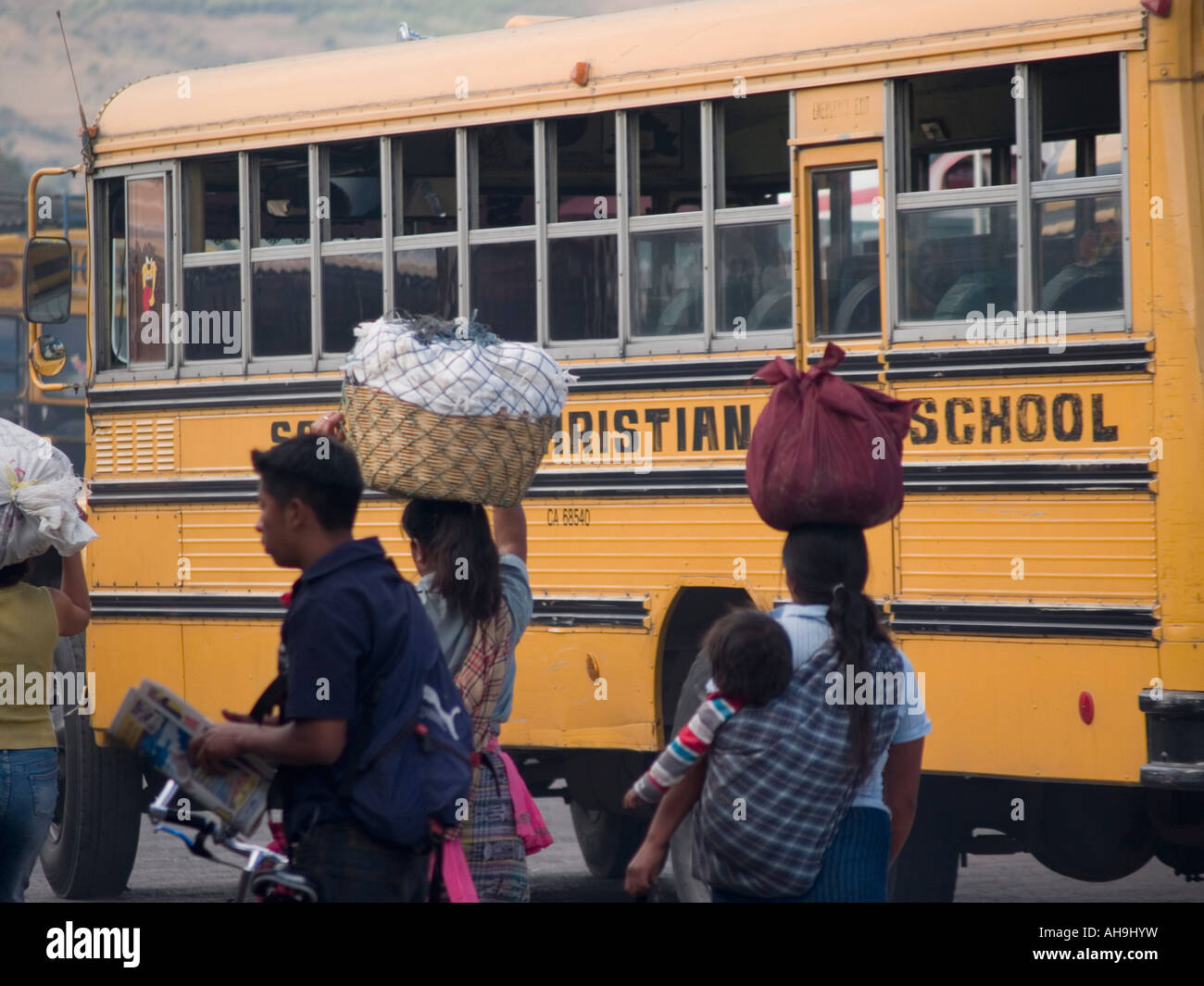 Workers at a bus station in Guatemala Stock Photo - Alamy