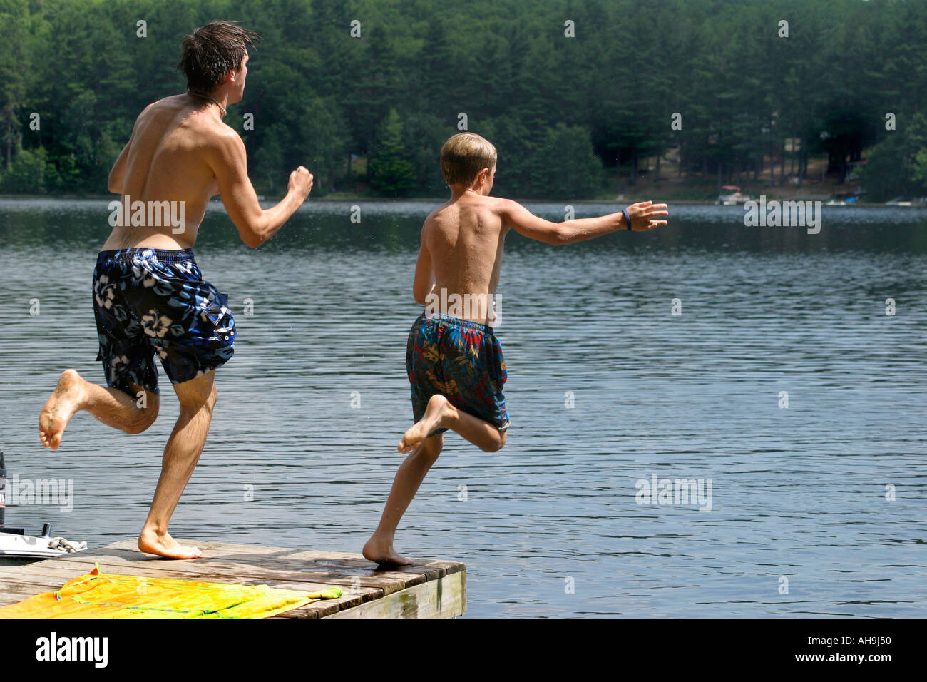 Jumping off dock hi-res stock photography and images - Alamy