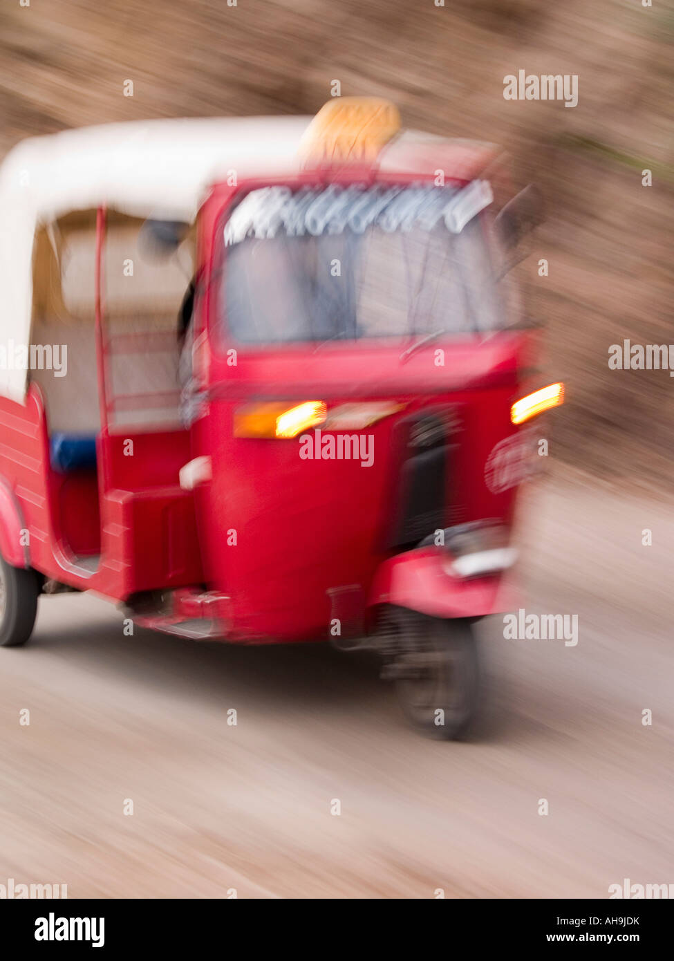 Three wheeled motorized taxi Stock Photo - Alamy
