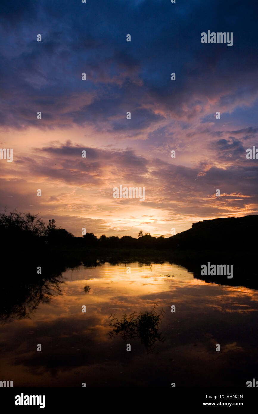 indian sunset over water Stock Photo - Alamy