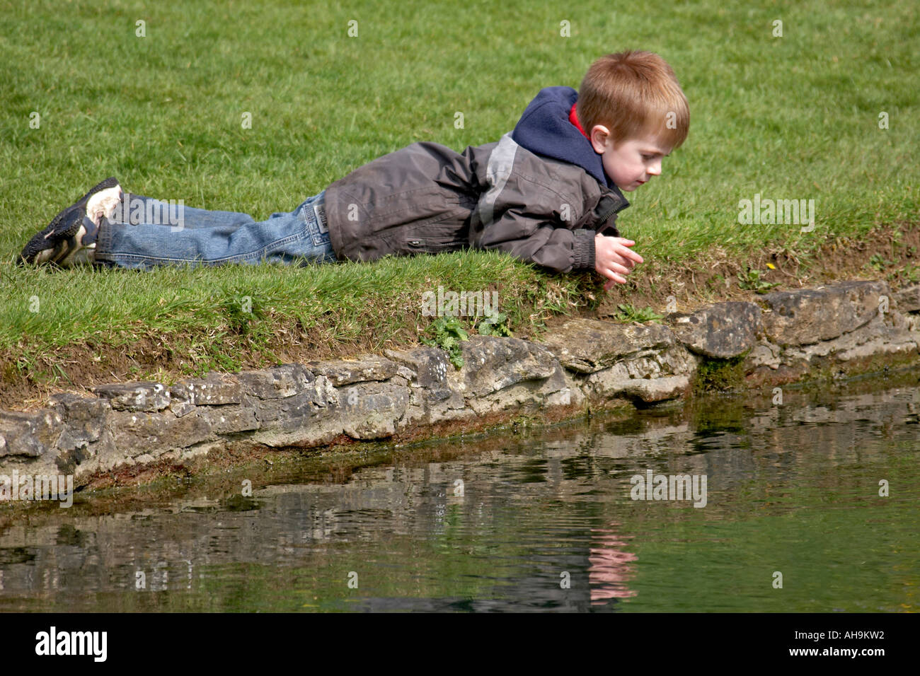Child boy pond with children uk hi-res stock photography and images - Alamy