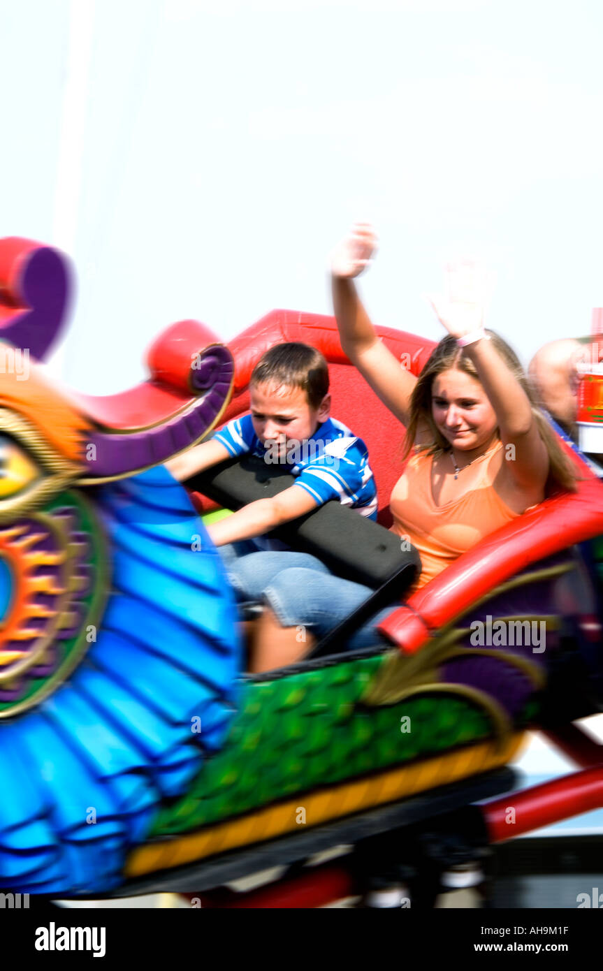 Kids on a carnival ride Stock Photo - Alamy