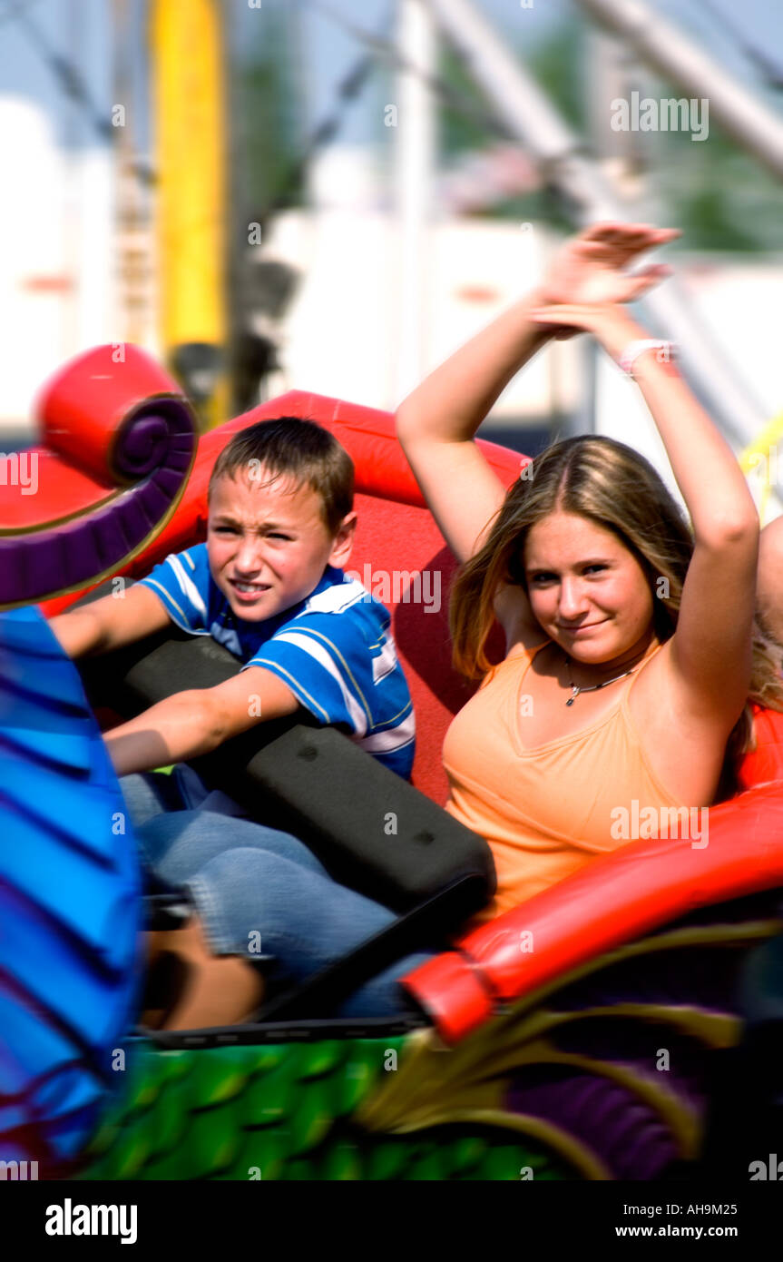 Kids on a carnival ride Stock Photo - Alamy