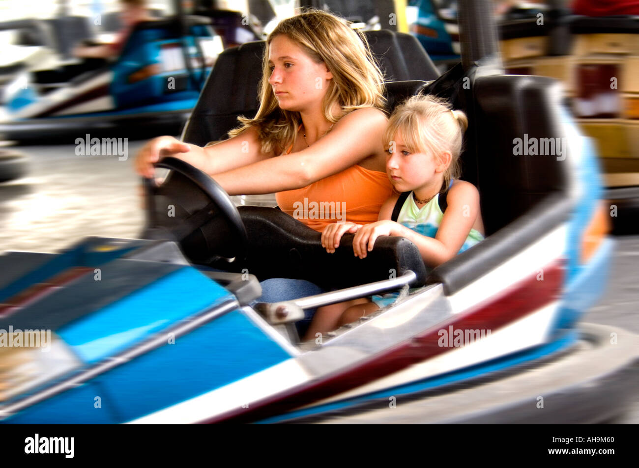 Girl riding a bumper car hi-res stock photography and images - Alamy