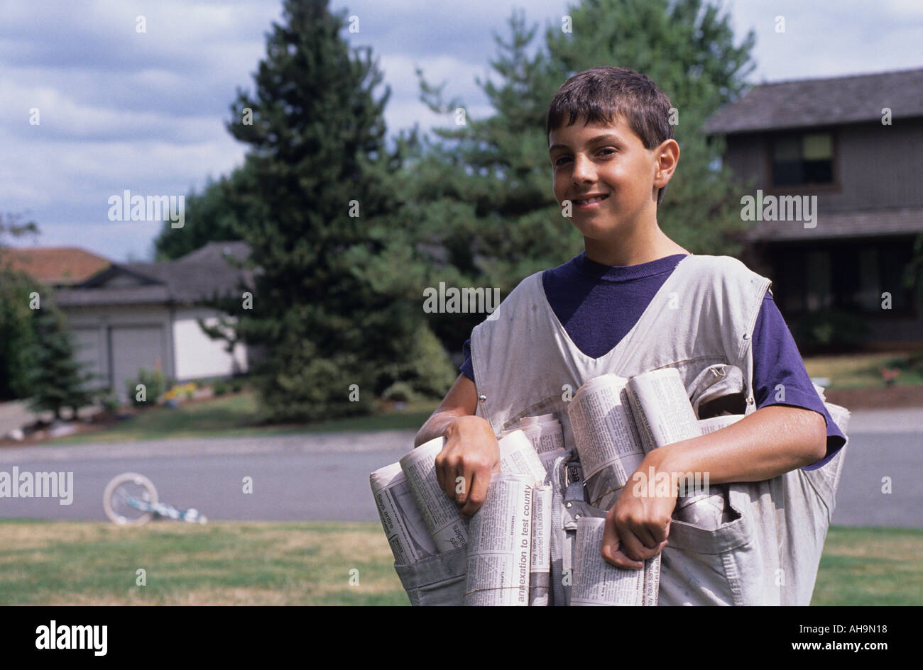 Young boy nine years old delivering papers on his route Stock Photo - Alamy