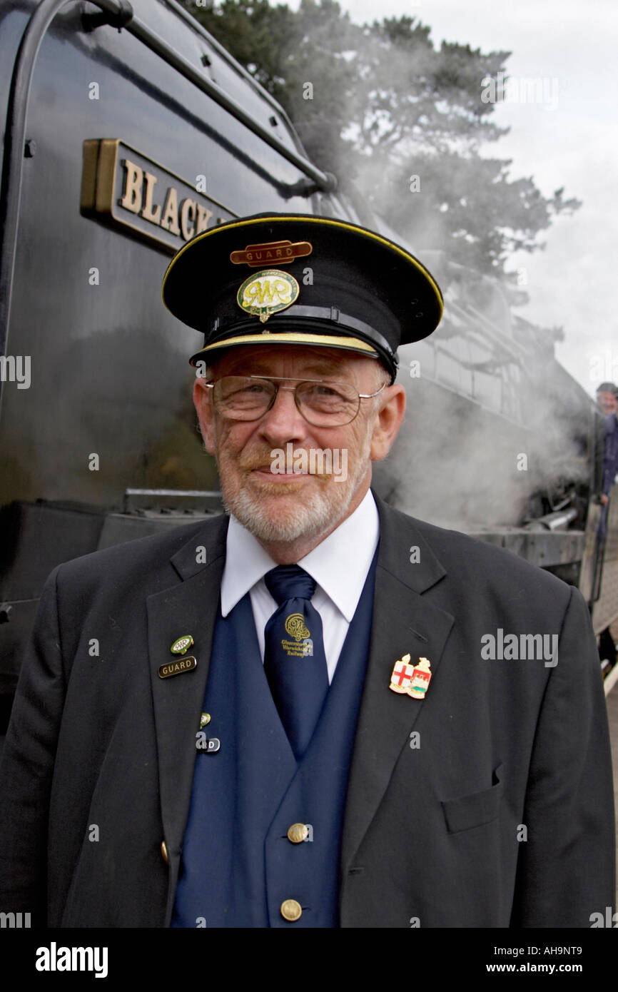 Volunteer train guard with Black Prince Steam Engine at Winchcombe ...