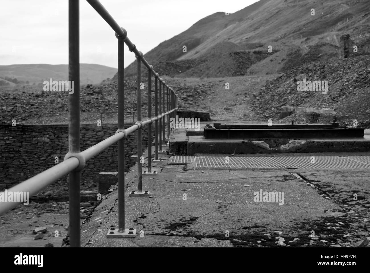 Black and white image of railing in a derelict lead mining village ...