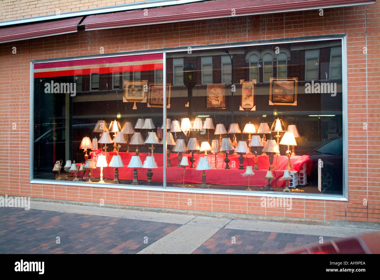 Lamps burning in store window Stock Photo - Alamy