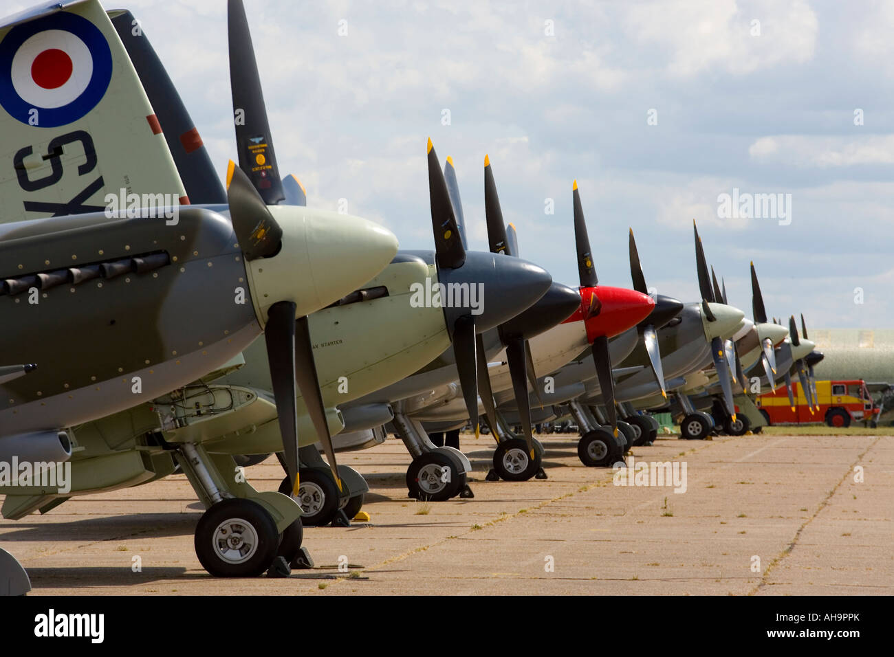 A line up of Supermarine Spitfires on a hard runway Stock Photo - Alamy